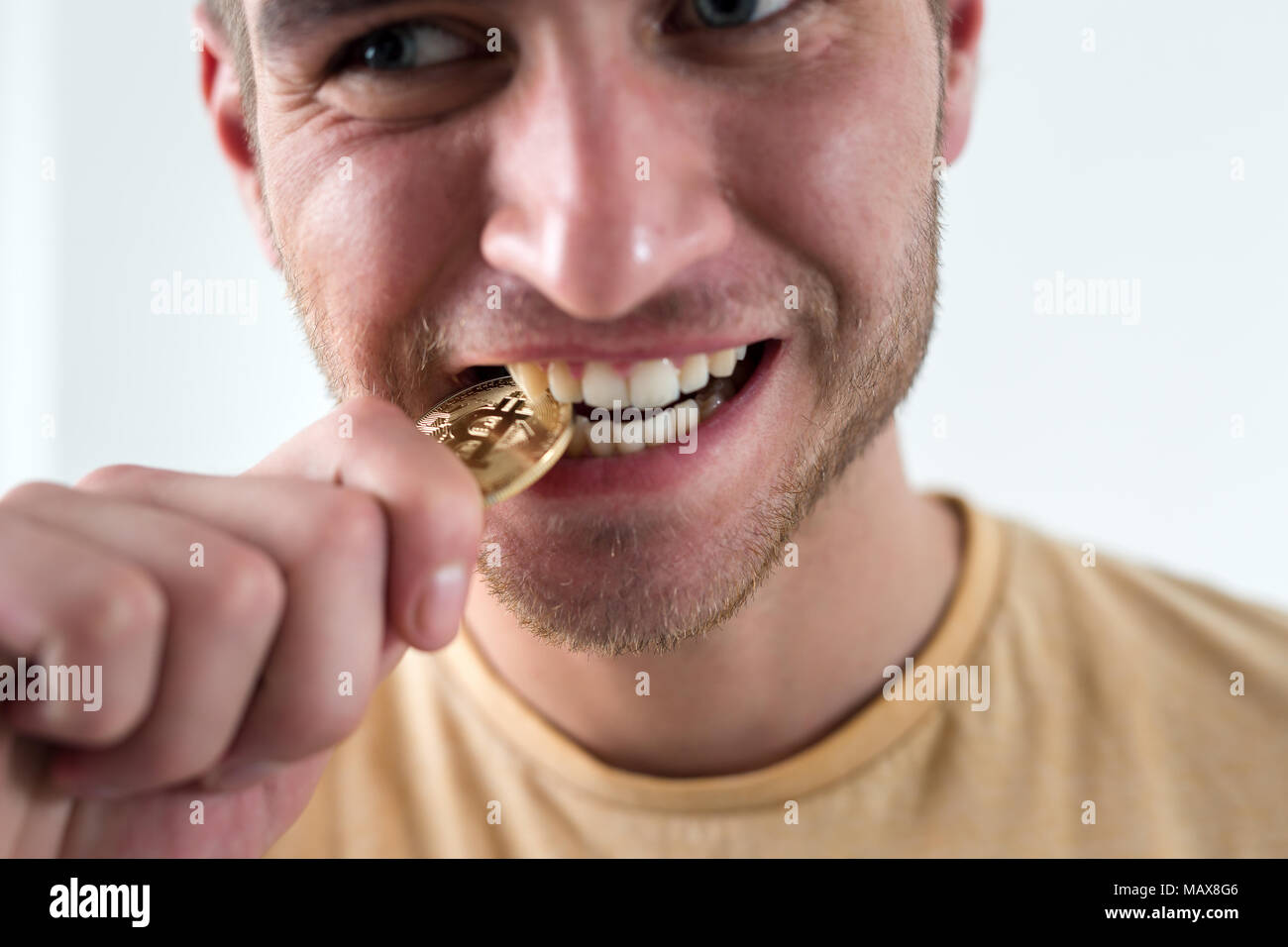 Biting Gold Coin High Resolution Stock Photography and Images - Alamy
