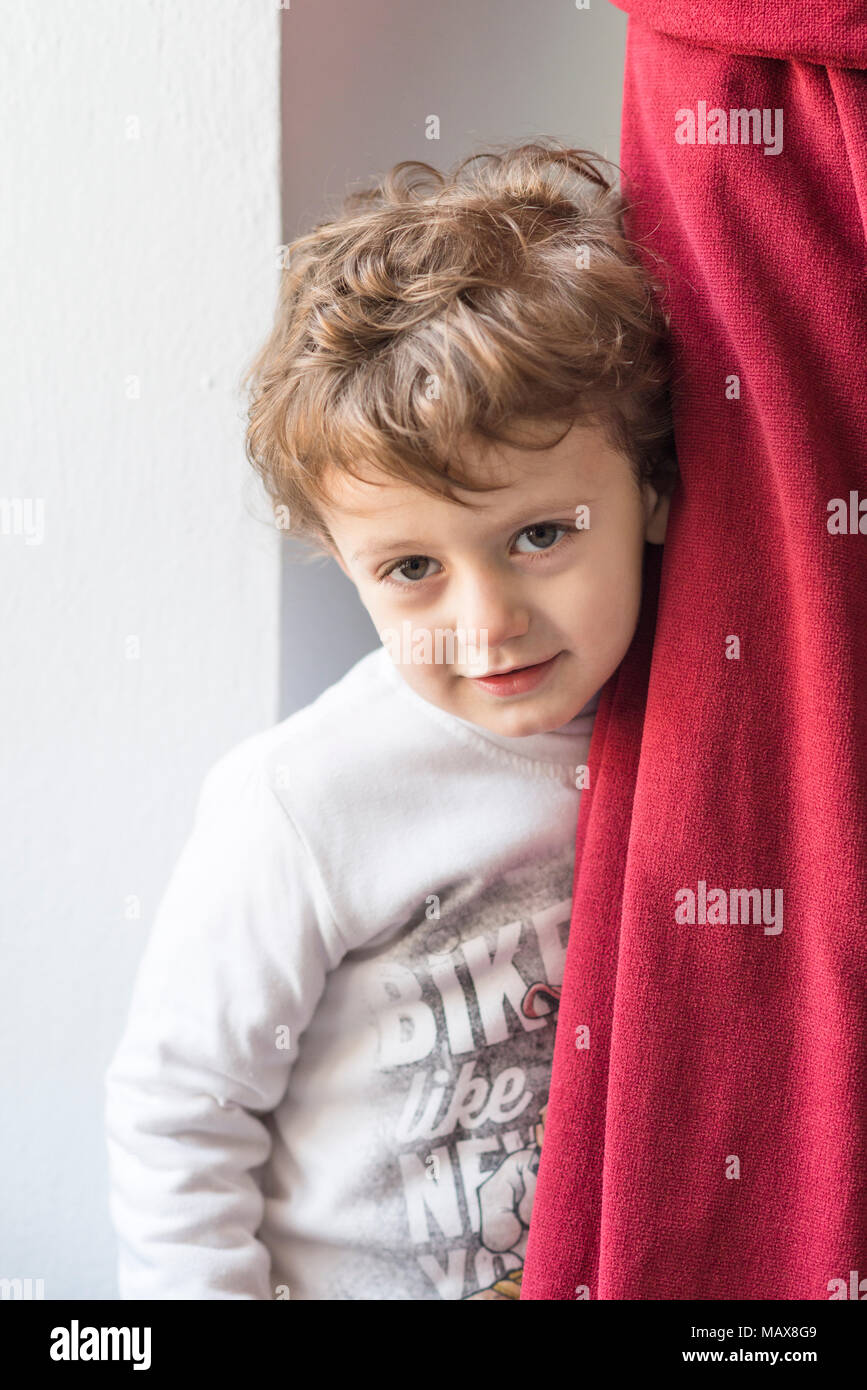 Child hiding behind curtain hi-res stock photography and images - Alamy
