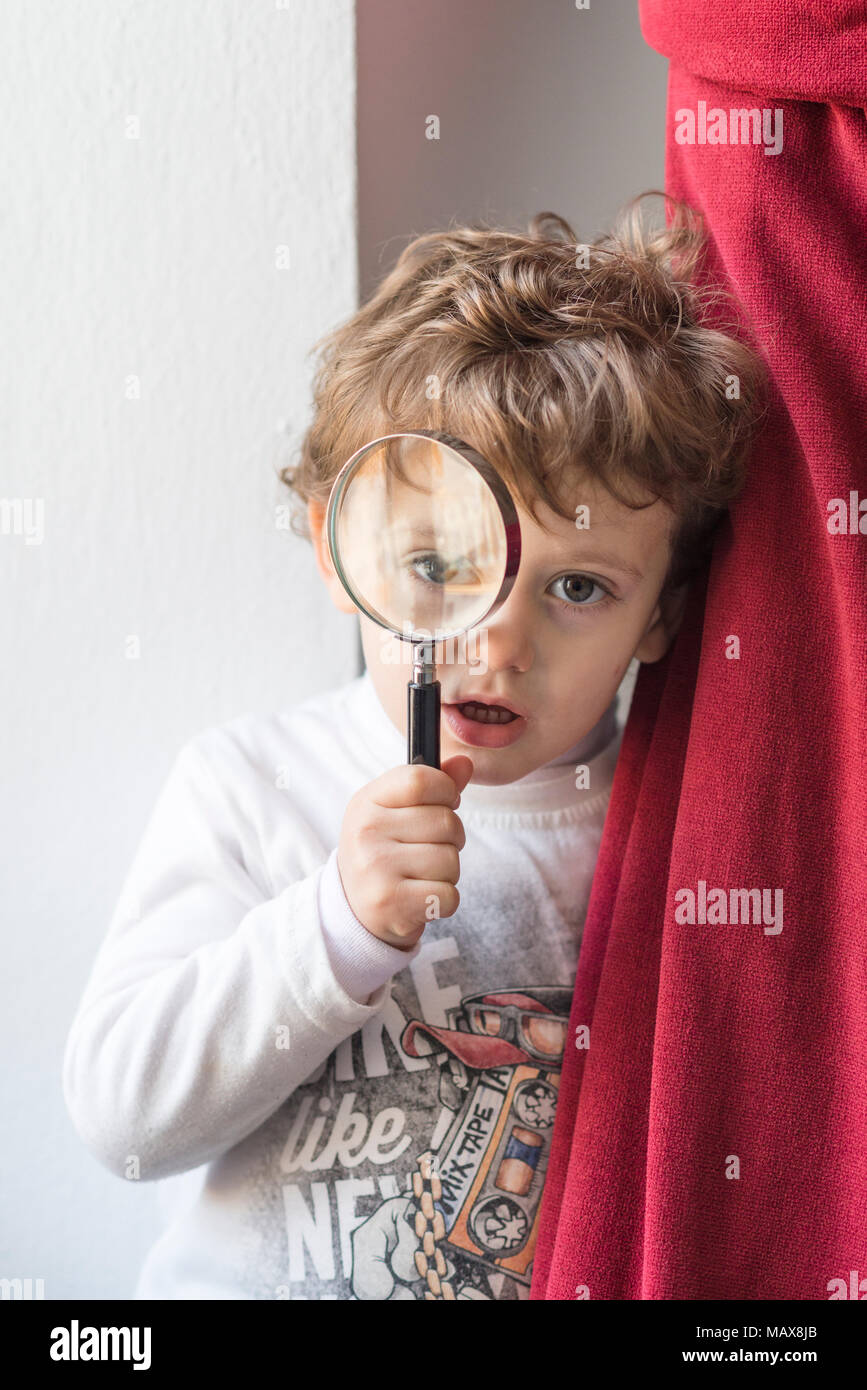 Child hiding behind curtain hi-res stock photography and images - Alamy