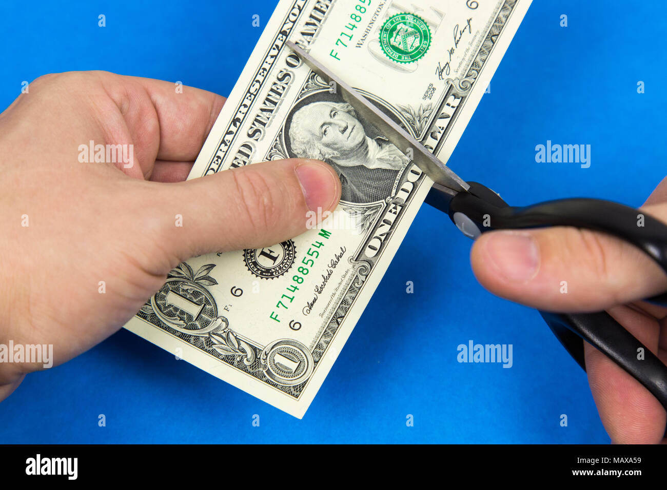 Cutting dollar sign hi-res stock photography and images - Alamy