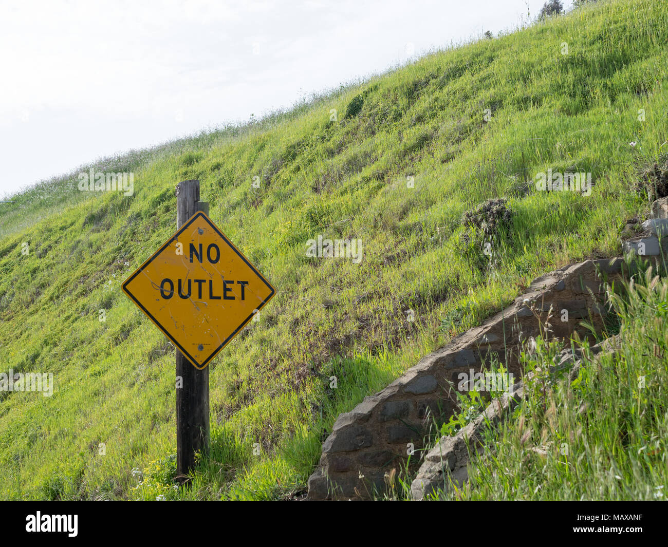 No outlet sign with stone stairs leading up to the right outdoors Stock ...