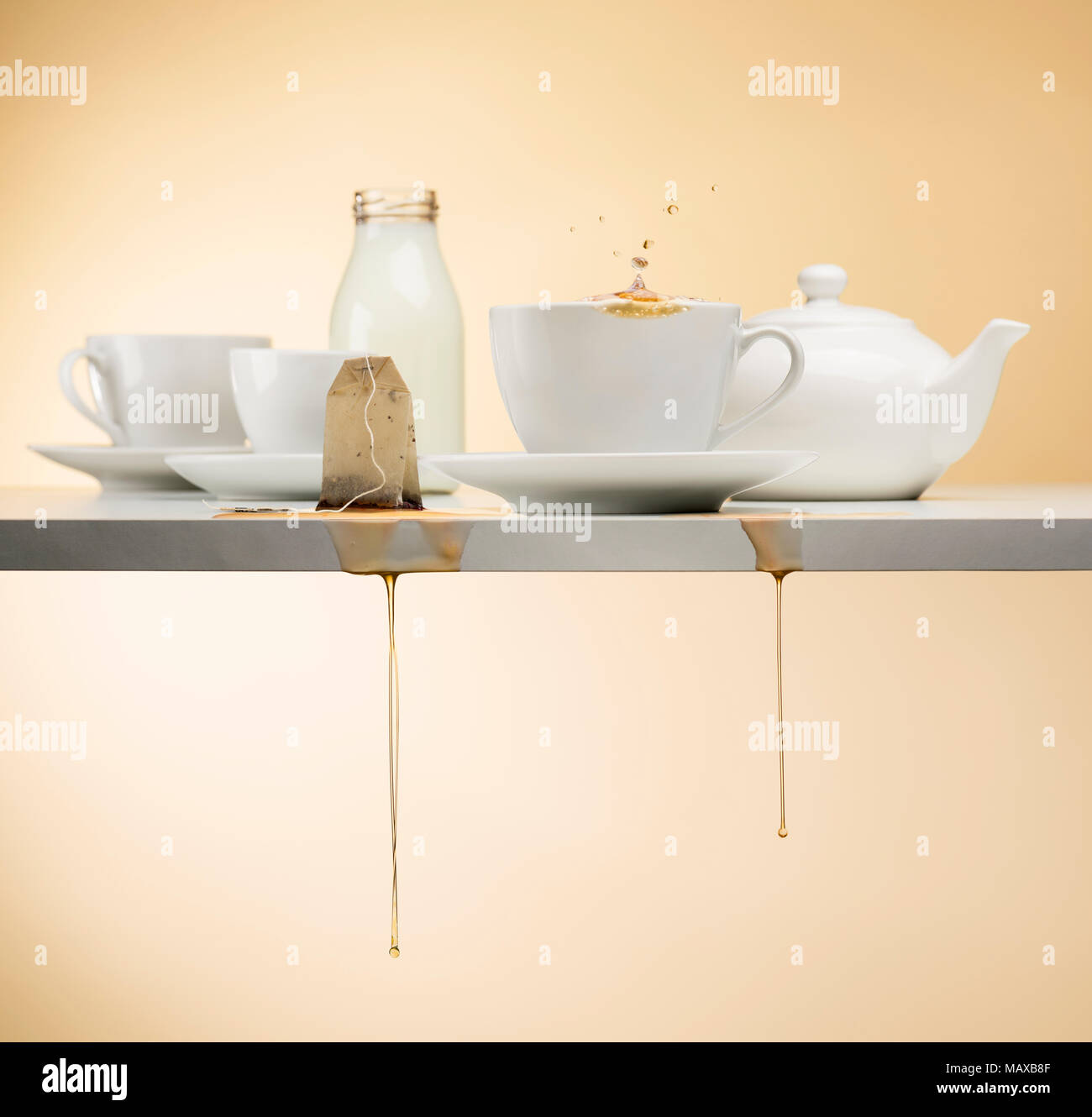 cup of tea on white table with wet tea bag dripping Stock Photo - Alamy