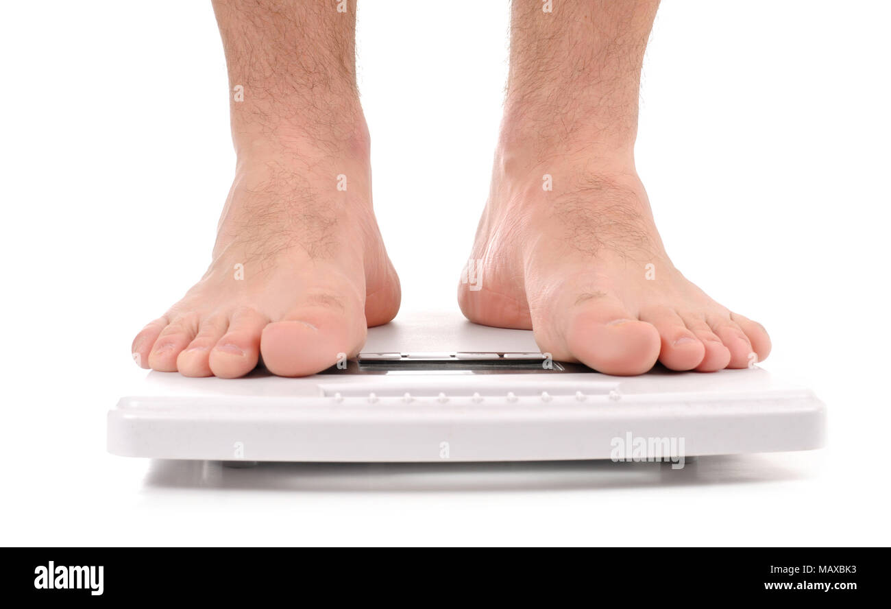 Overweight man standing on scale Cut Out Stock Images & Pictures - Alamy