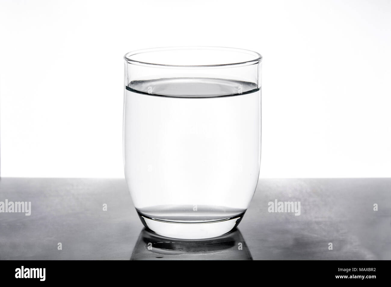 Glass with water on white background Stock Photo - Alamy