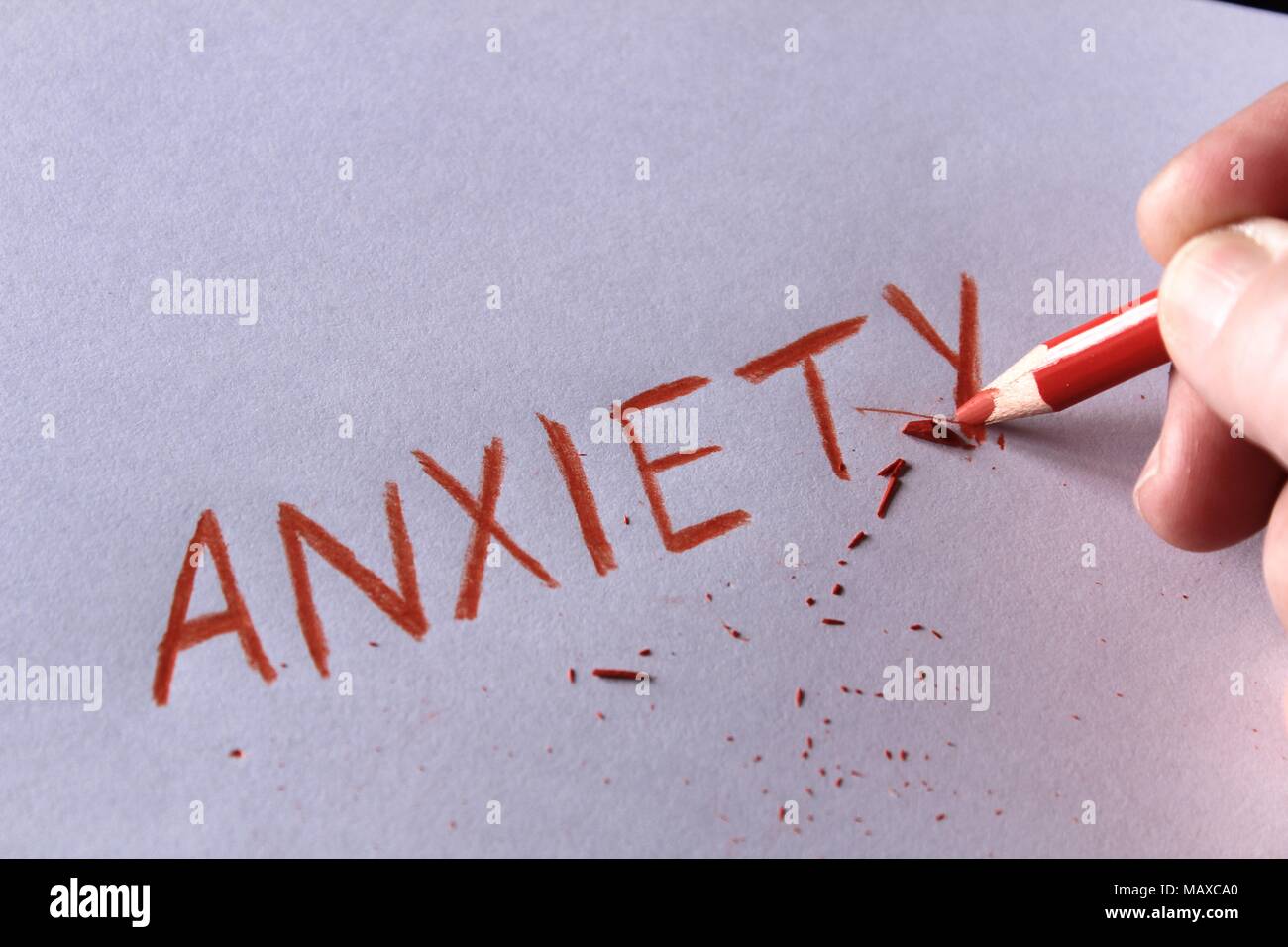 Anxiety concept. Word anxiety written on white paper with red pencil ...