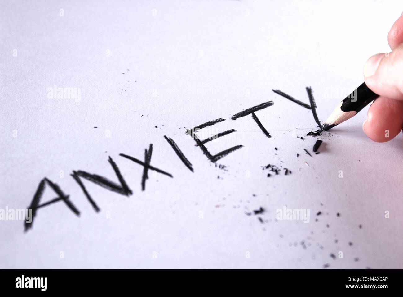 Anxiety concept. Word anxiety written on white paper with black pencil ...