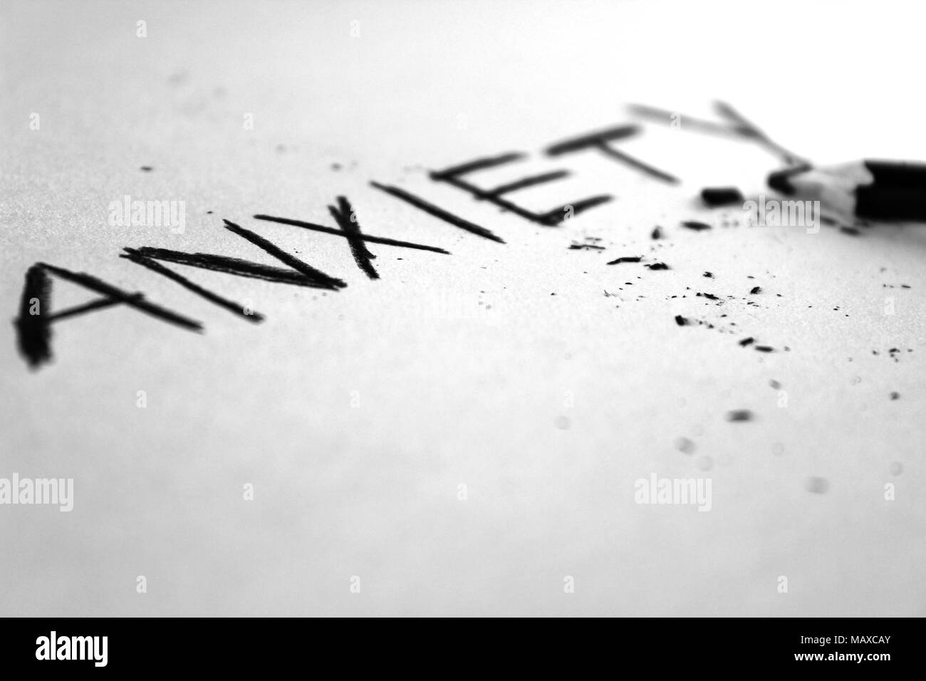 Anxiety concept. Word anxiety written on white paper with black pencil ...