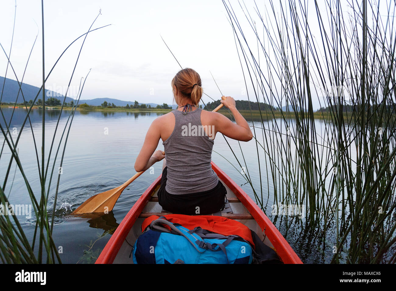 Woman paddling canoe hi-res stock photography and images - Alamy