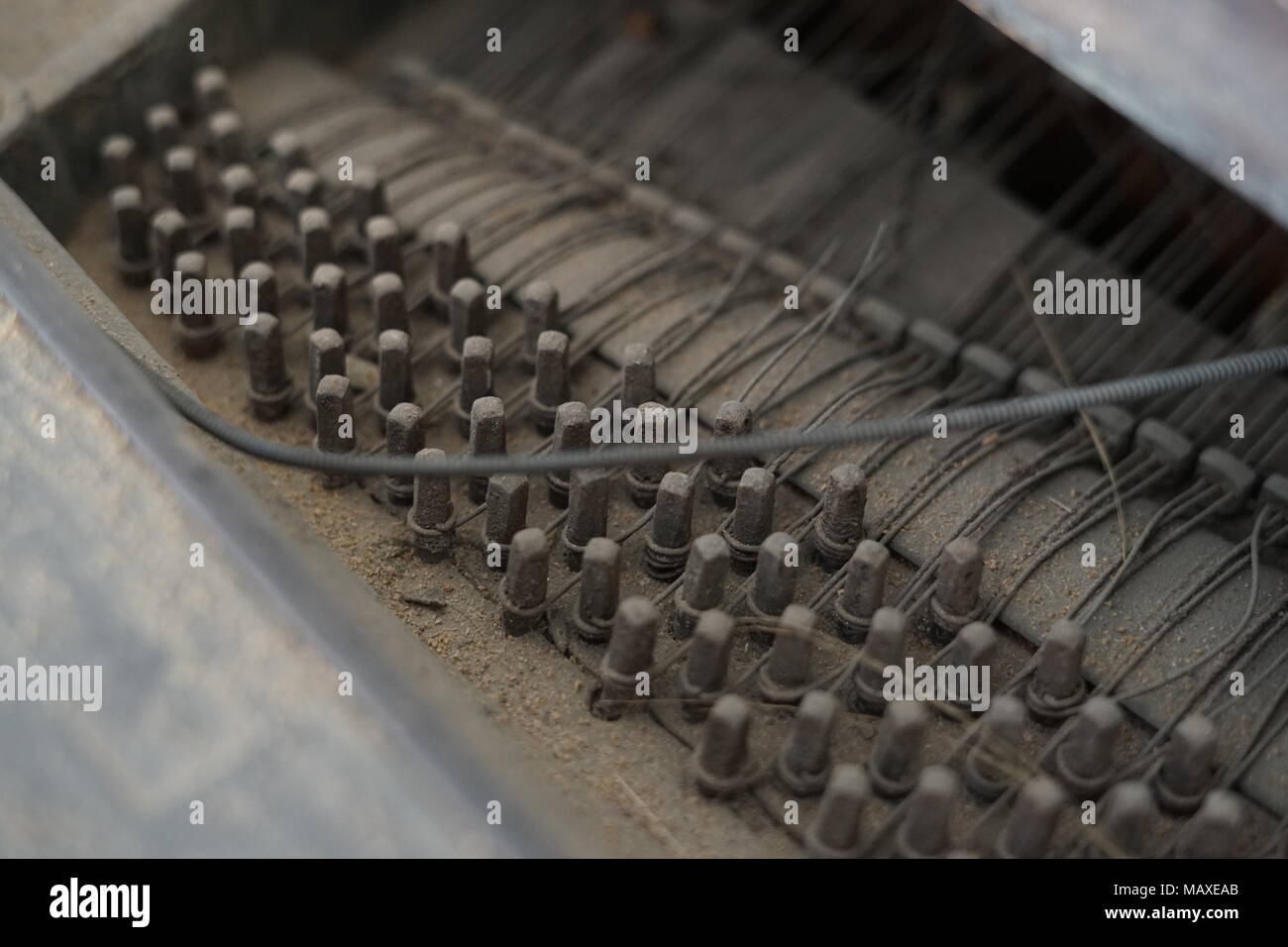 Old, broken dusty and antique piano strings lying around Stock Photo ...