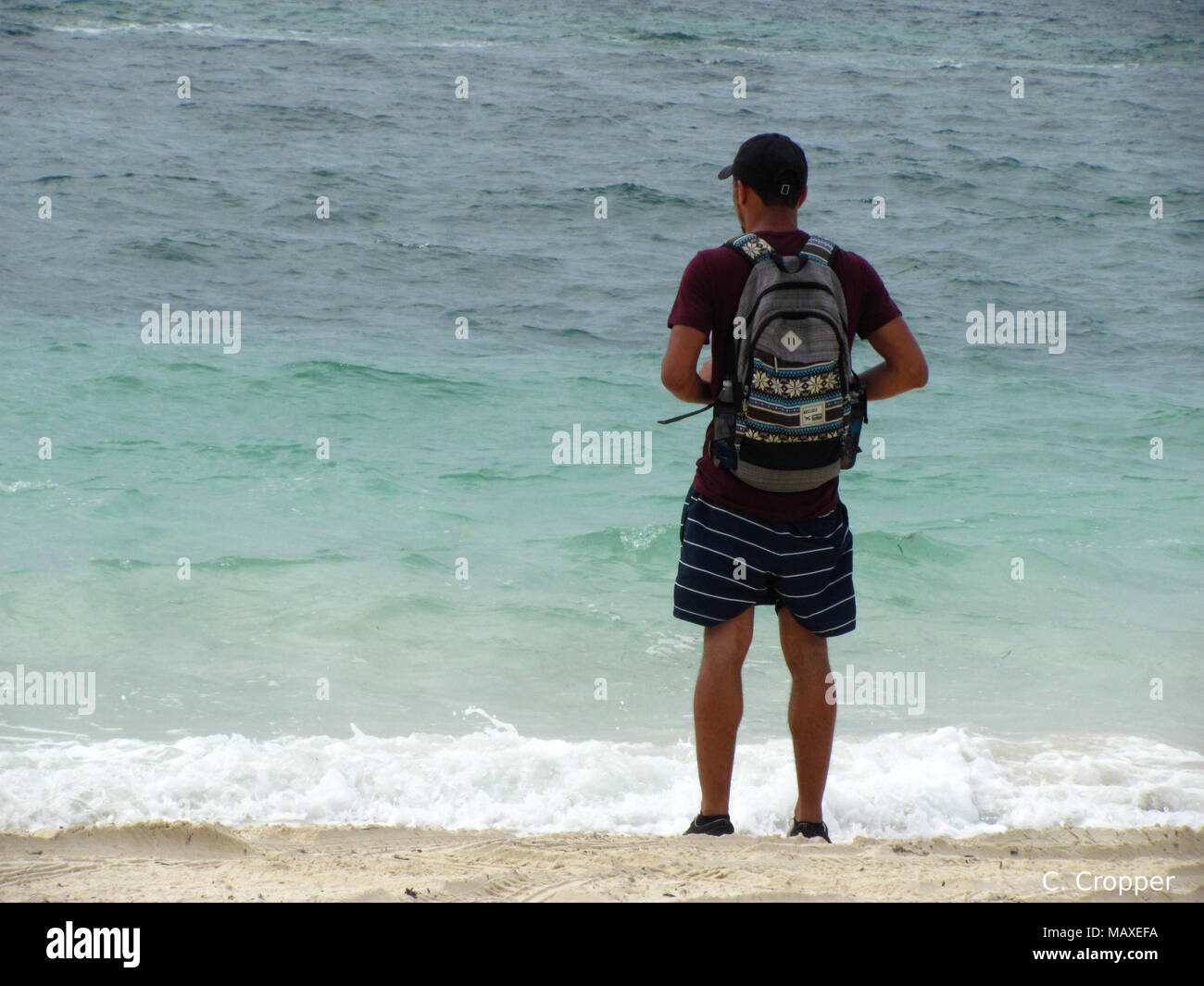 One person standing on beach shore in the Bahamas Stock Photo - Alamy
