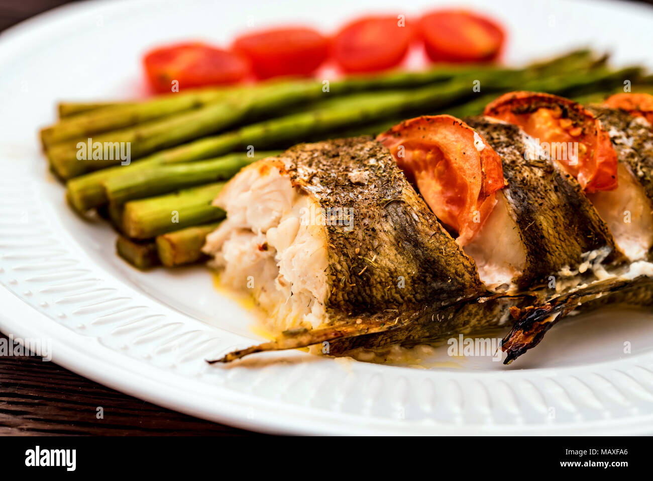 Roasted zander fillet with asparagus and lemon Stock Photo - Alamy