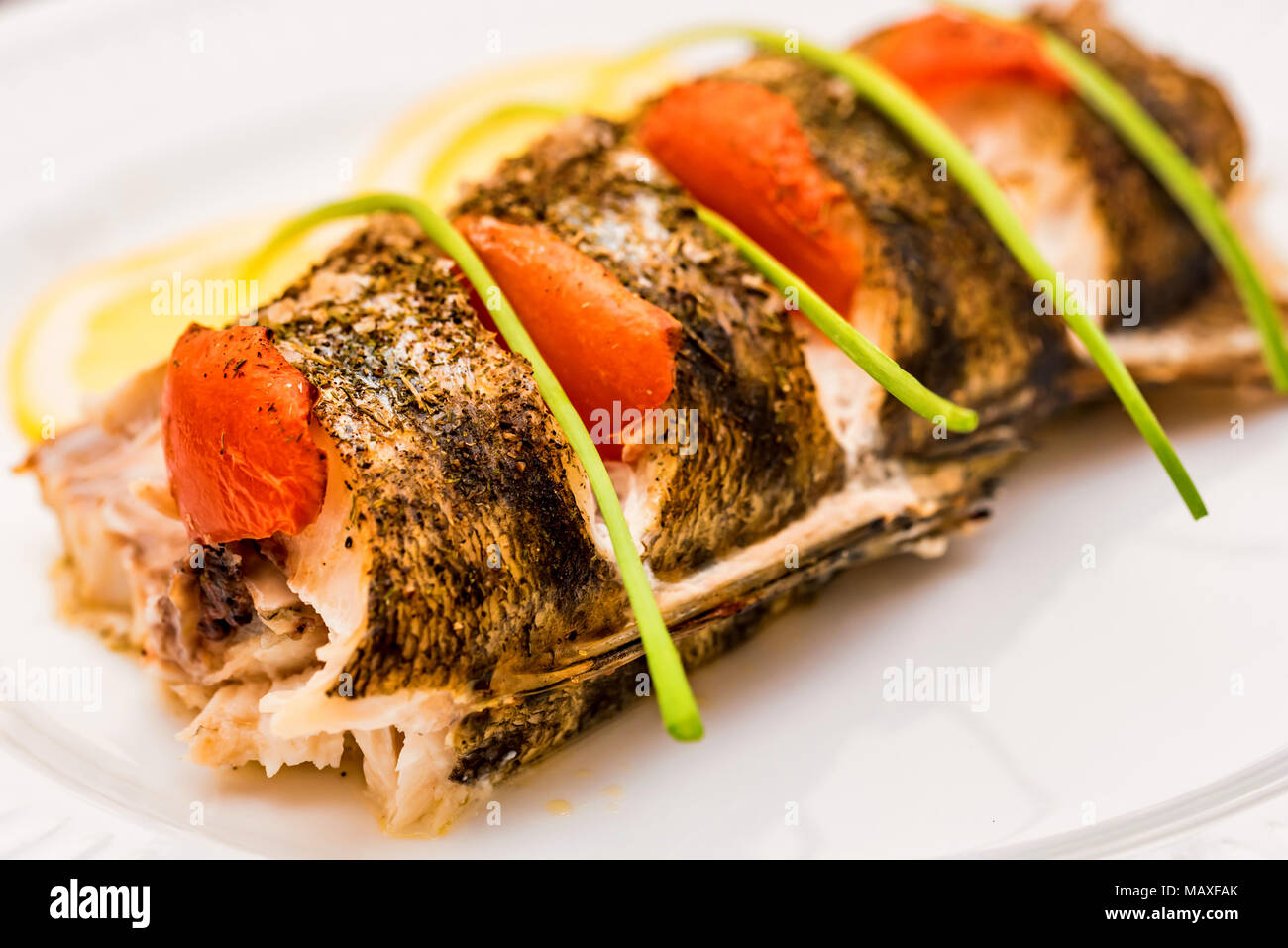 Roasted zander fillet with asparagus and lemon Stock Photo - Alamy