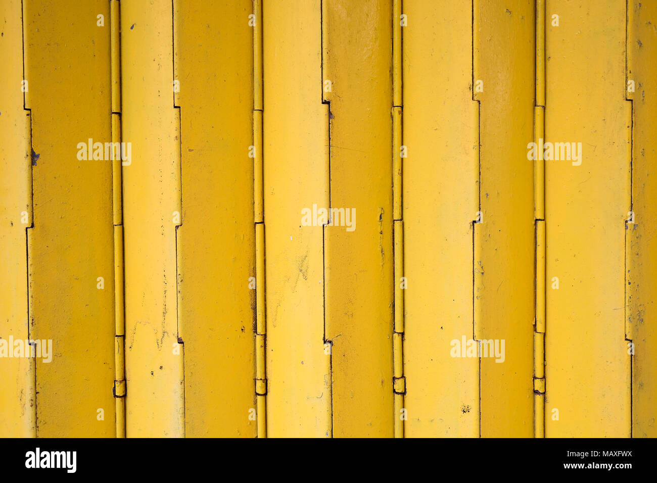 Yellow rusty shutter door background Stock Photo - Alamy