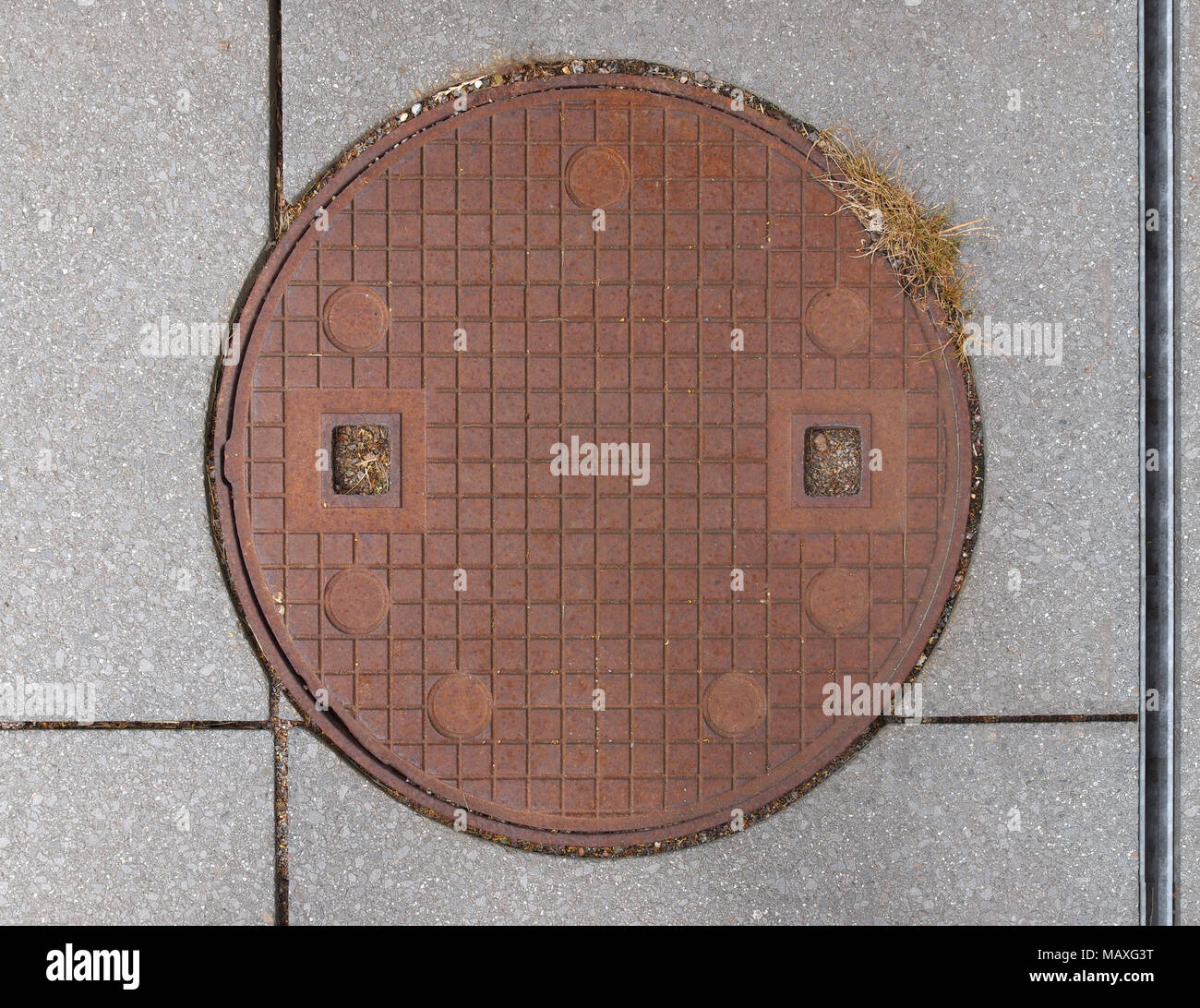 Detail of a manhole in the street Stock Photo - Alamy