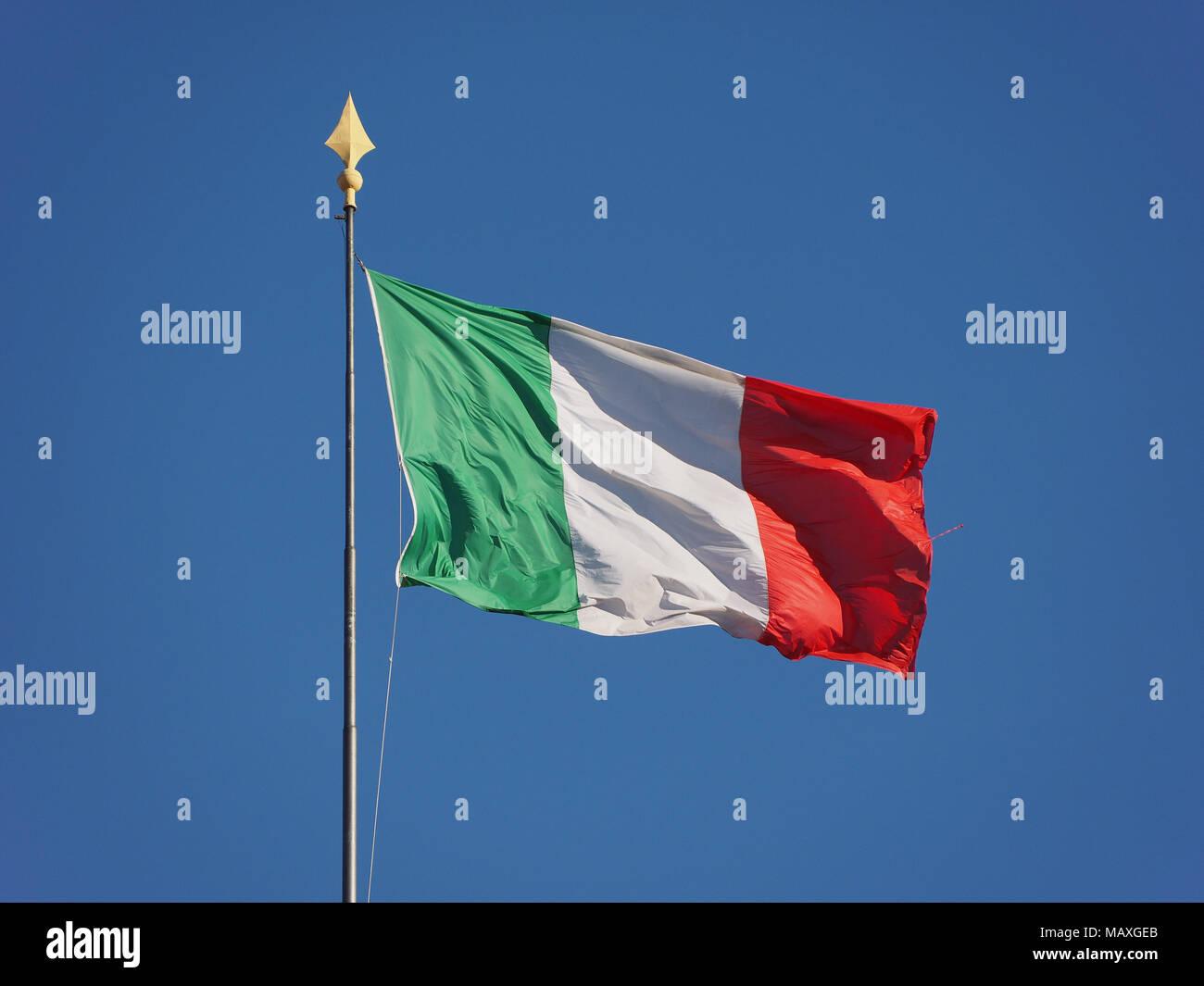 the Italian national flag of Italy, Europe over blue sky Stock Photo ...
