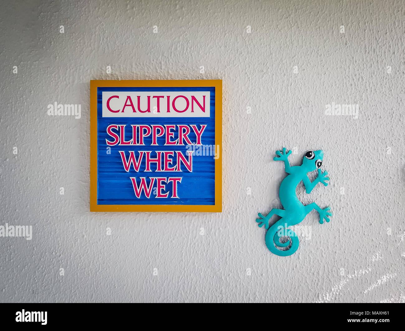 sign saying slippery when wet, caution. typical craft artwork depicting ...