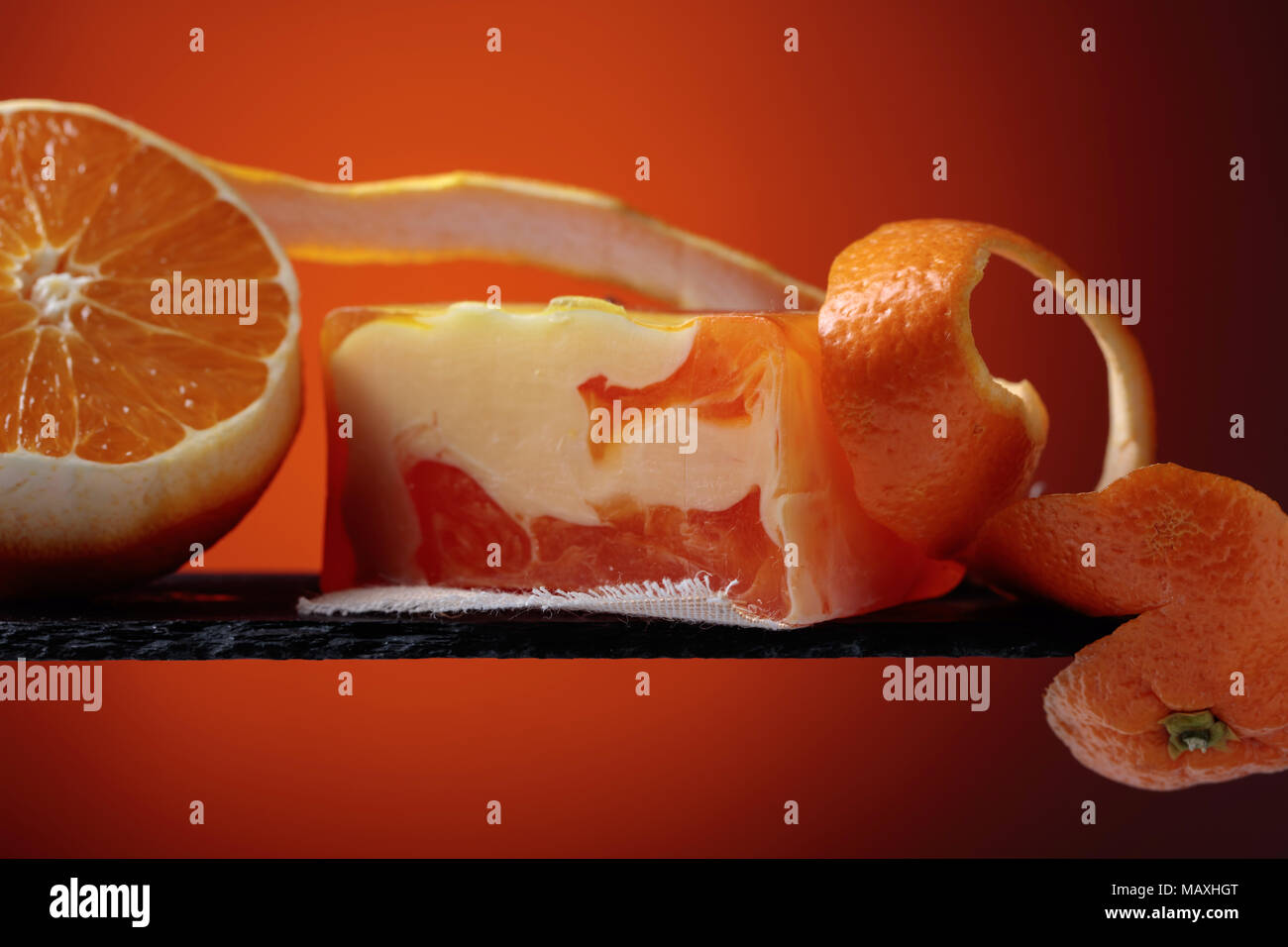 Bar of natural organic soap with orange on a orange background ...