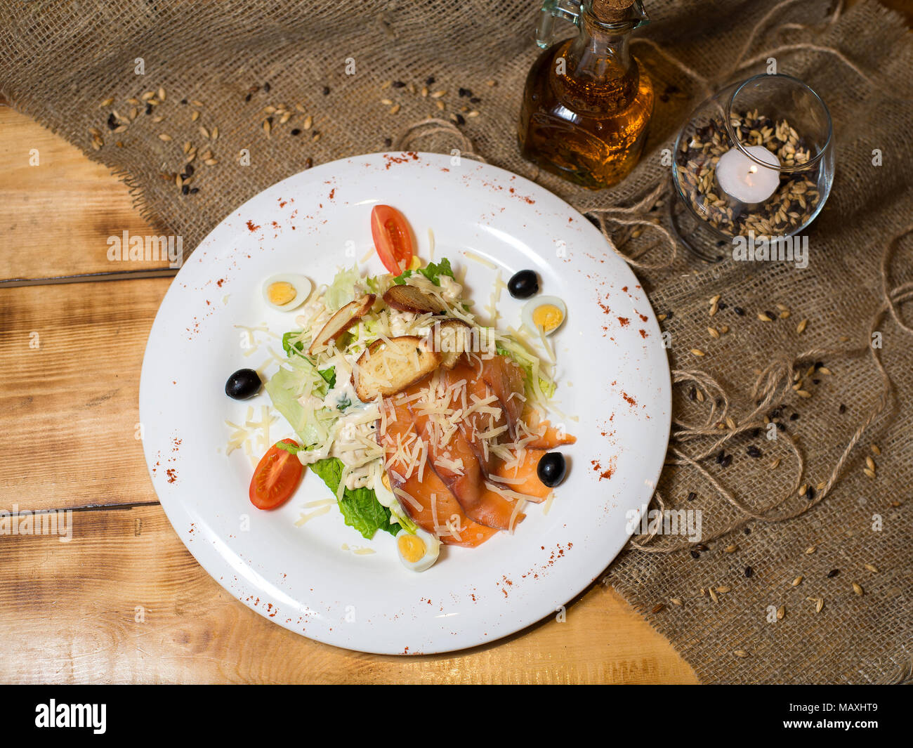 Vegetable salad fish on a white plate on a tree Stock Photo - Alamy