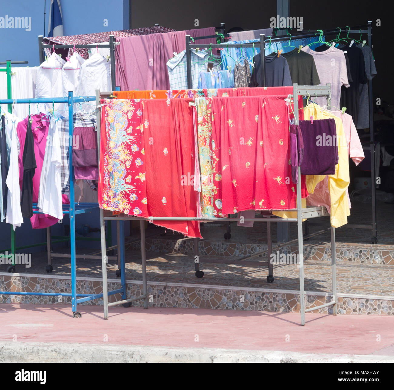 Clothes hanging on the street Stock Photo - Alamy