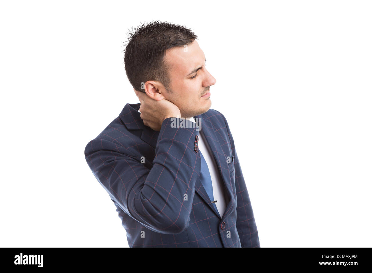 Banker or broker grabbing his painful scruff or nape as stress and ...