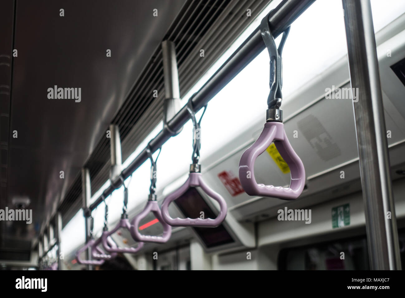 Hand Grips Row on Subway Under Flourescent Light Asian Subway Stock ...