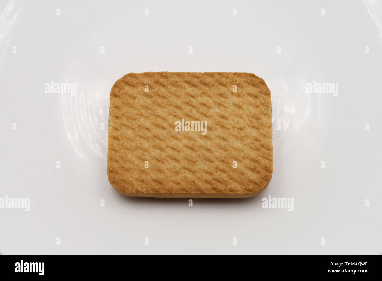 One square biscuits. One square flat biscuits. Close-up Stock Photo - Alamy
