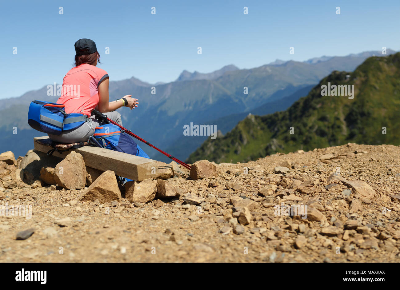 Girl with backpack and sticks for sport walk Stock Photo - Alamy