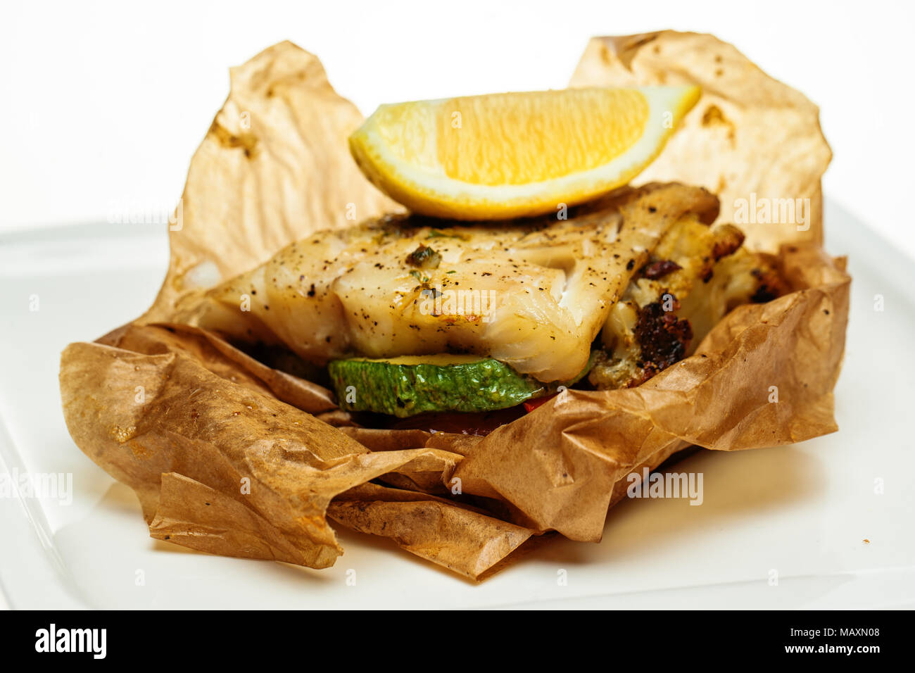 Cod fish fillet closeup. Grilled cod fish with vegetable. Healthy Diet ...
