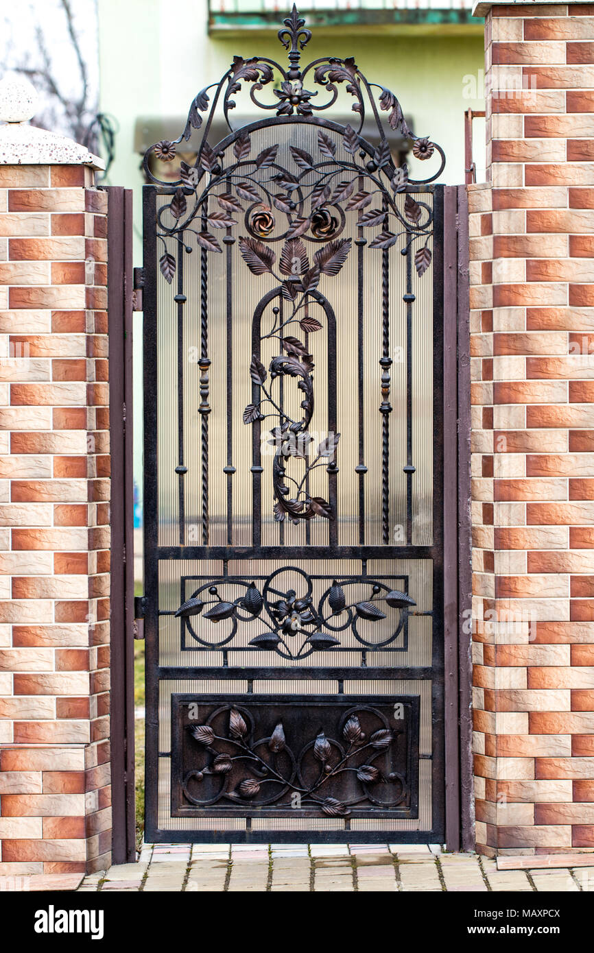 door decoration with ornate wrought-iron elements, close up Stock Photo ...