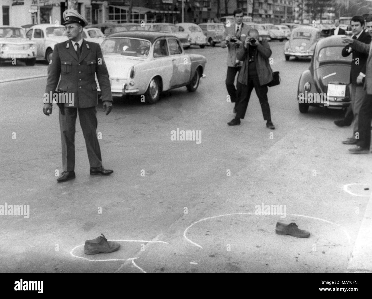 A photographer takes pictures of Dutschke's shoes, marked by the police ...