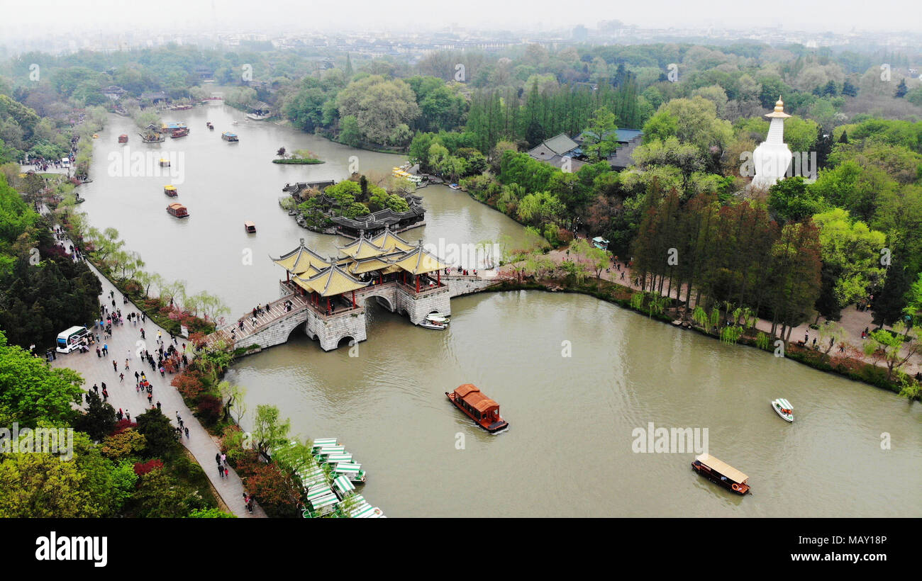 Yangzhou. 5th Apr, 2018. Tourists visit the Slender West Lake scenic ...