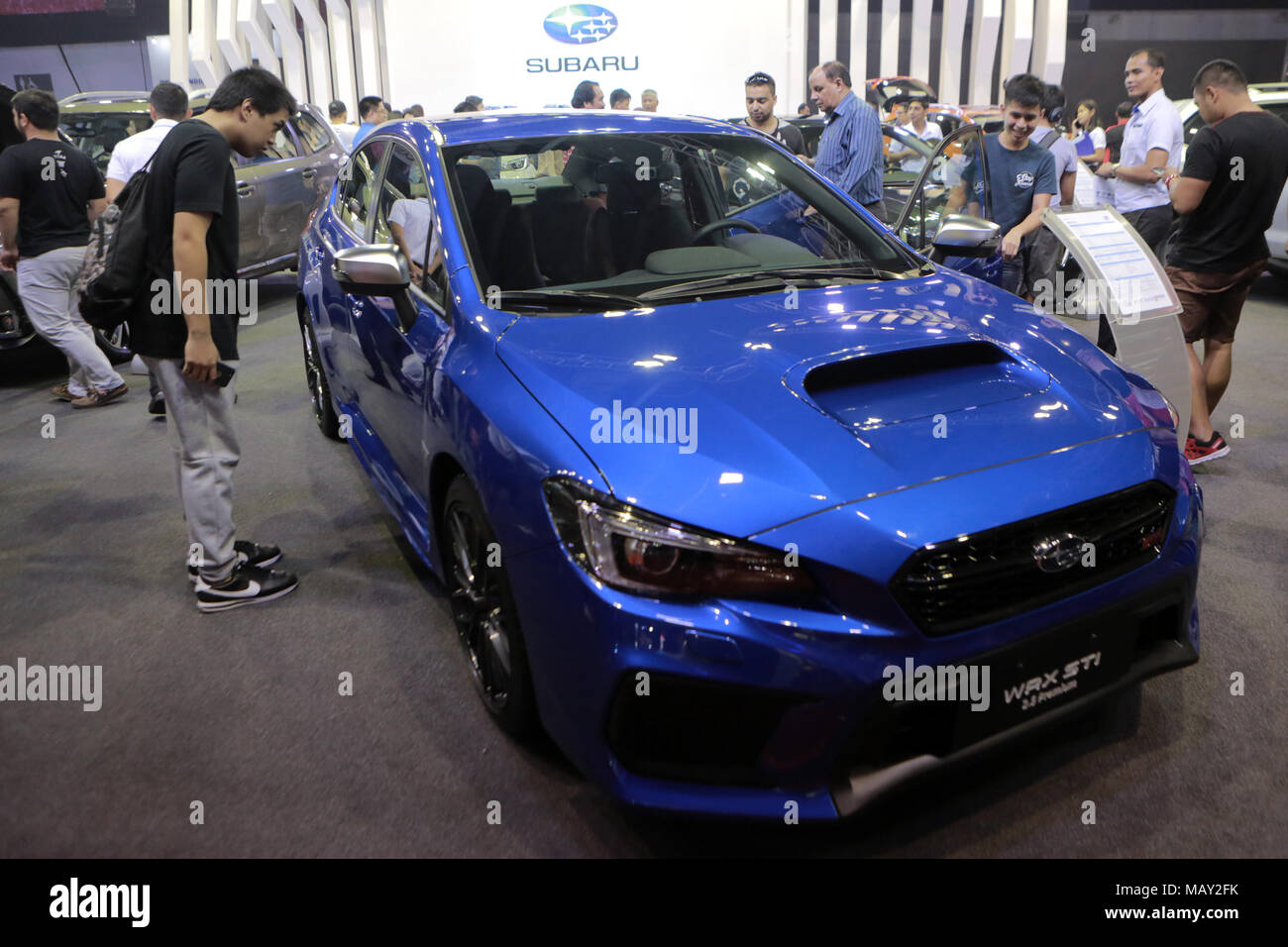 Pasay City, Philippines. 5th Apr, 2018. Visitors look at a Subaru WRX ...
