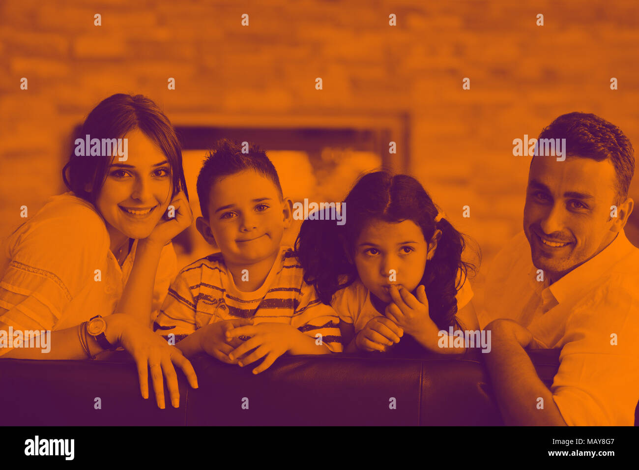 happy young family relax and have fun at modern home indooor duo tone ...