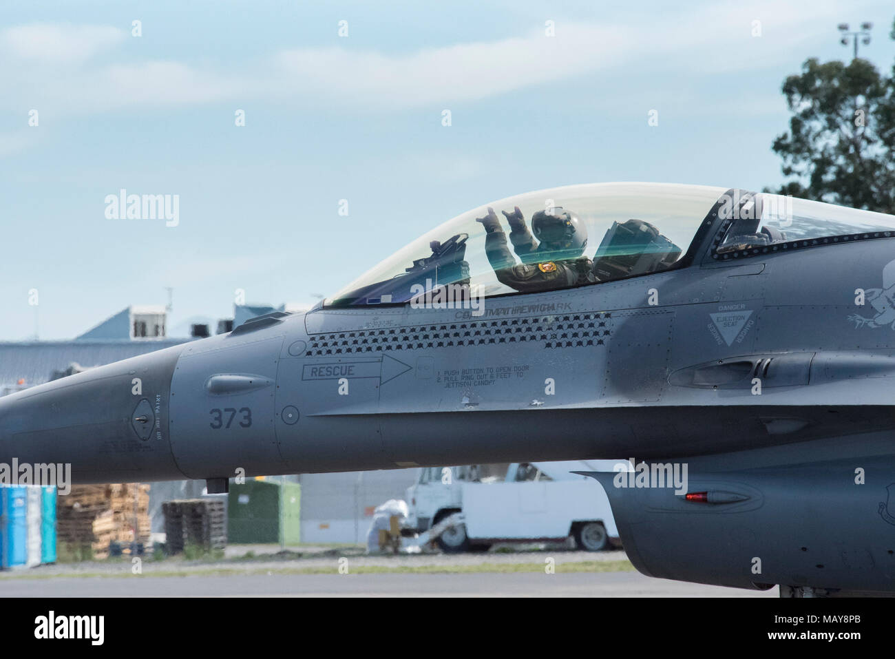 First Lt. Taylor Absher, 14th Fighter Squadron F-16 pilot, signals the ...