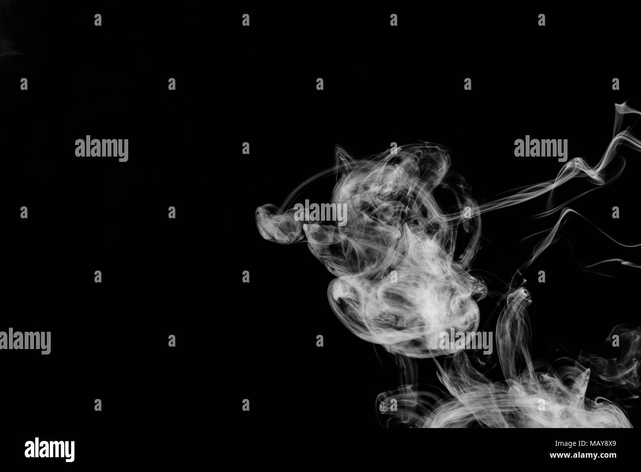 Thick white smoke on a black isolated background. Background from the ...