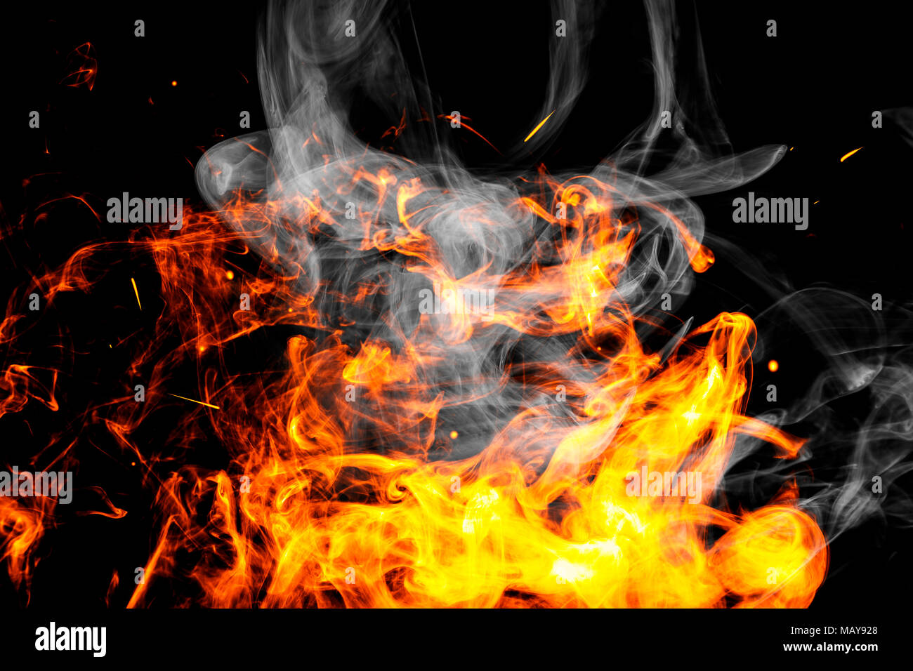 Dense fiery flames smoke on a black isolated background. Background of ...