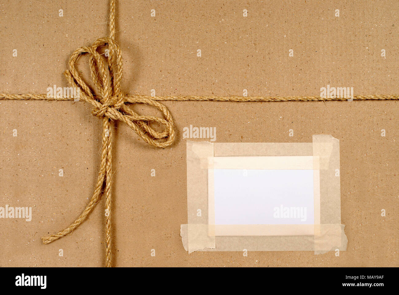 Brown paper parcel background with string and copyspace Stock Photo - Alamy