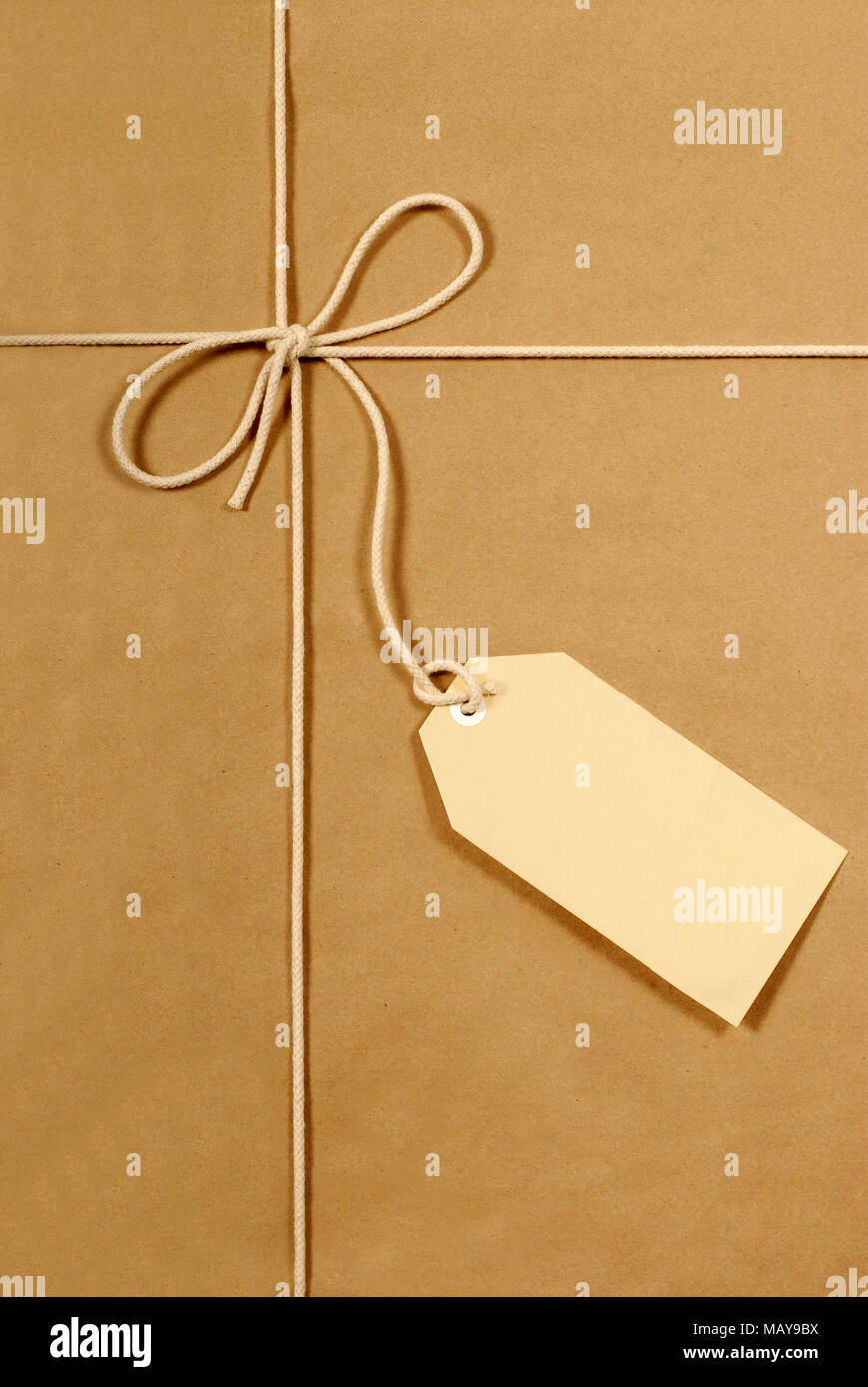 Brown paper parcel post label tied hi-res stock photography and images ...