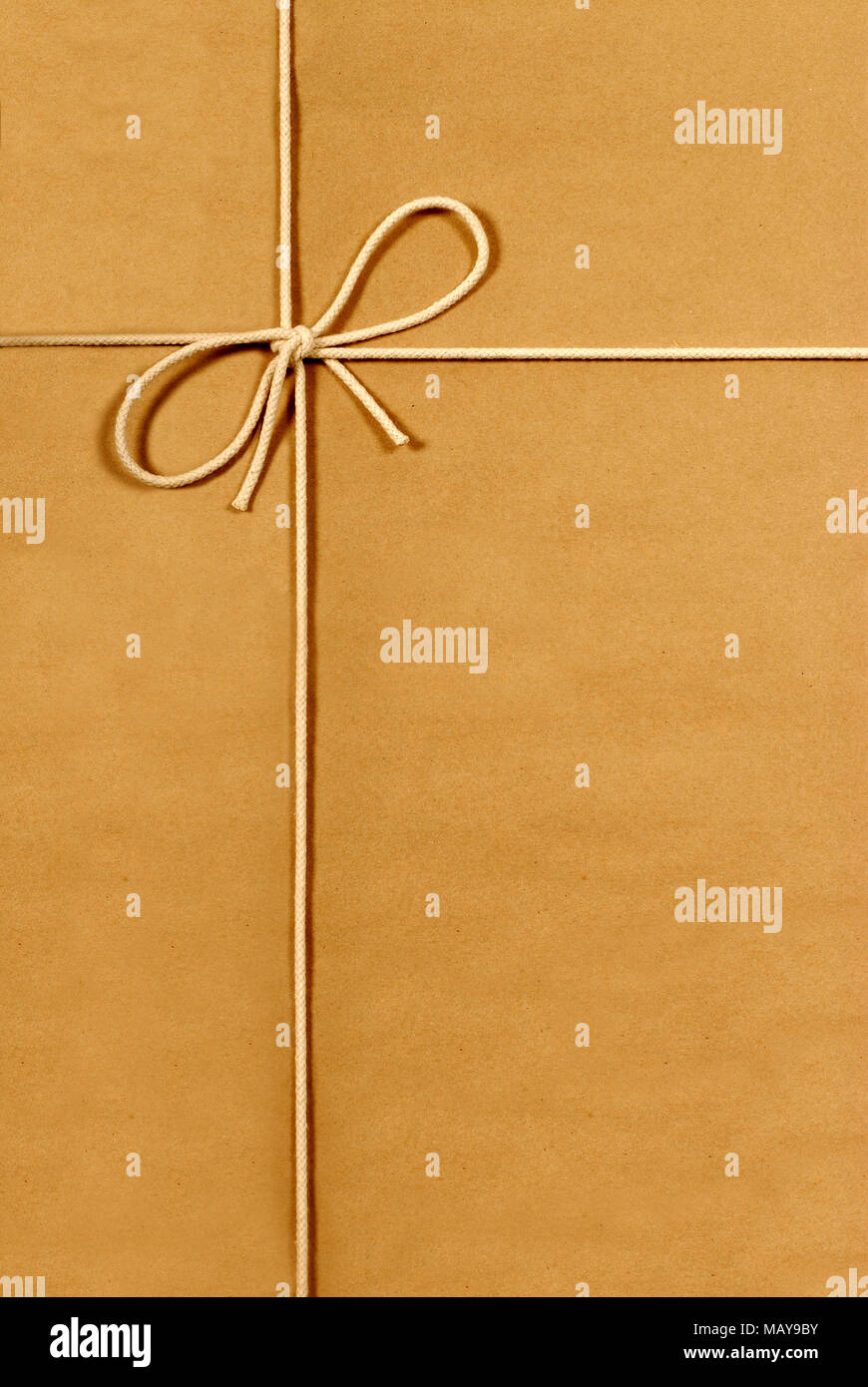 Brown paper parcel background with string and copyspace Stock Photo - Alamy
