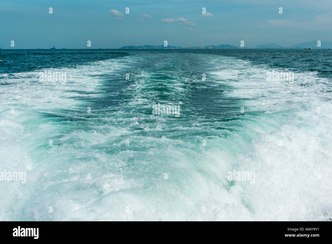 Splashed out water from engine of ship running on sea Stock Photo - Alamy