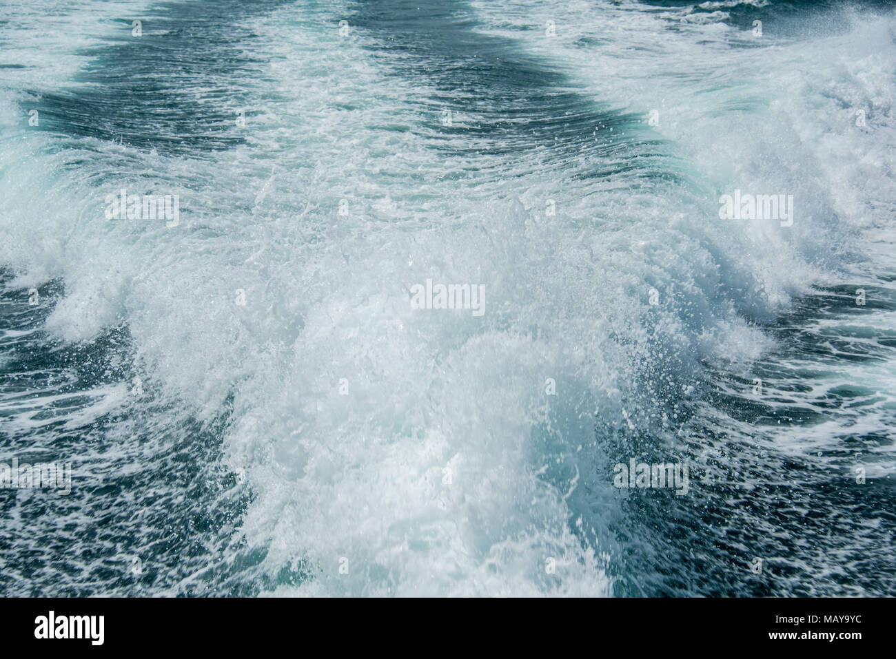 Splashed out water from engine of ship running on sea Stock Photo - Alamy