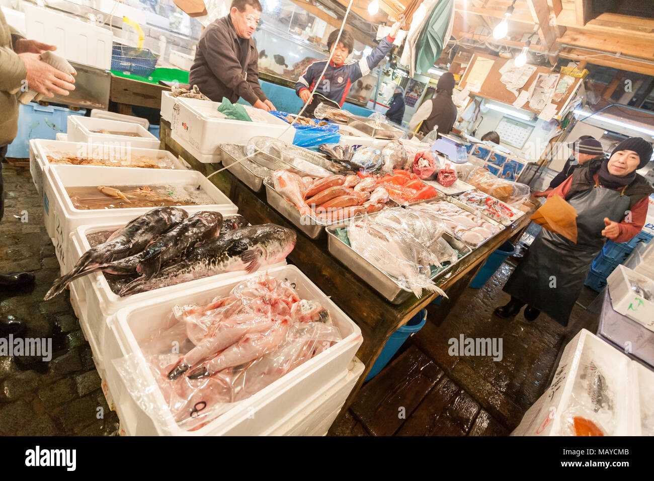 Tokyo, Japan. Early morning in Tsukiji Fish Market. The first customers ...