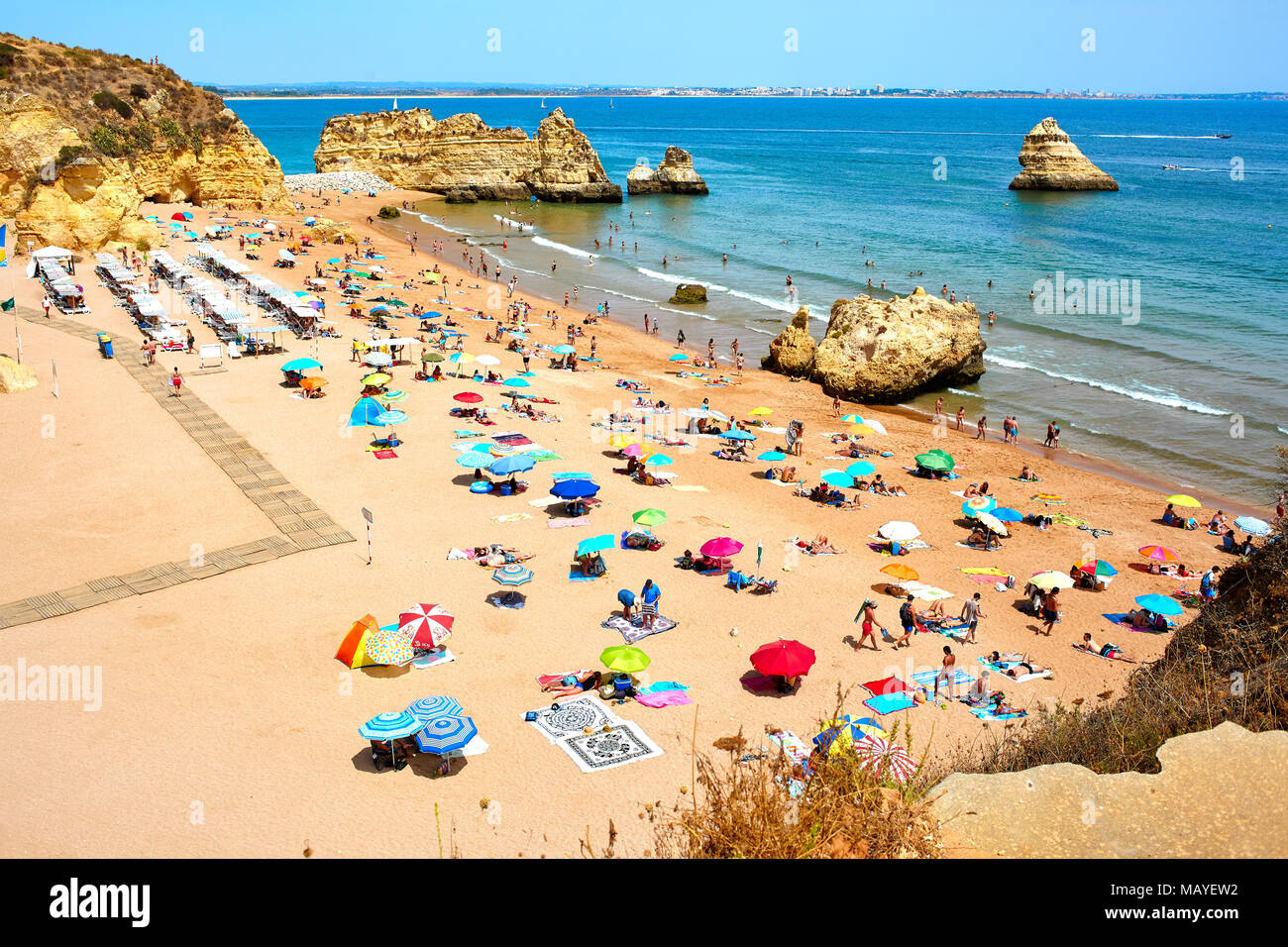 Cliff rocks and sea bay with turquoise water in Lagos, Algarve region ...