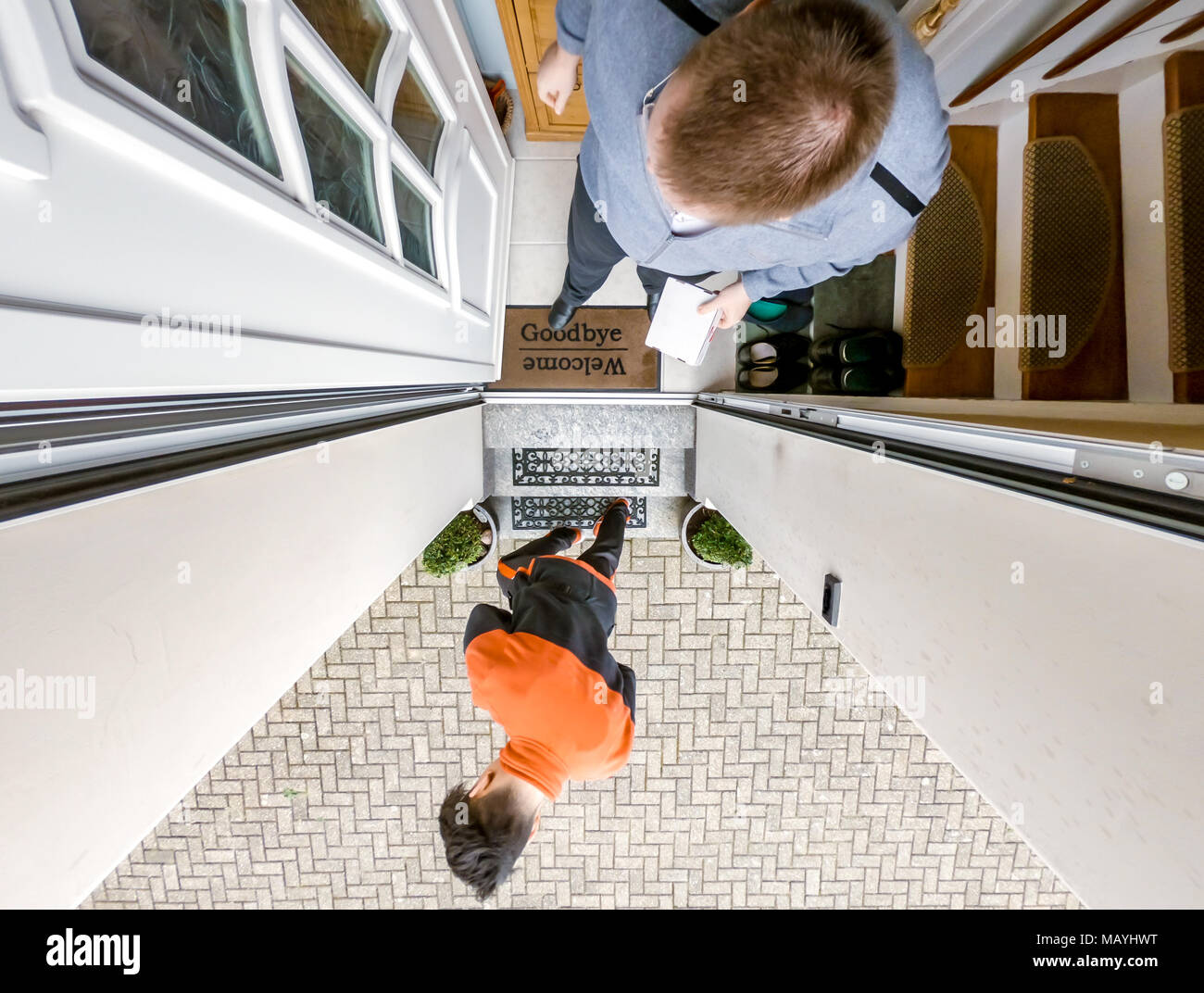 Postman Delivering Parcel High Resolution Stock Photography and Images ...