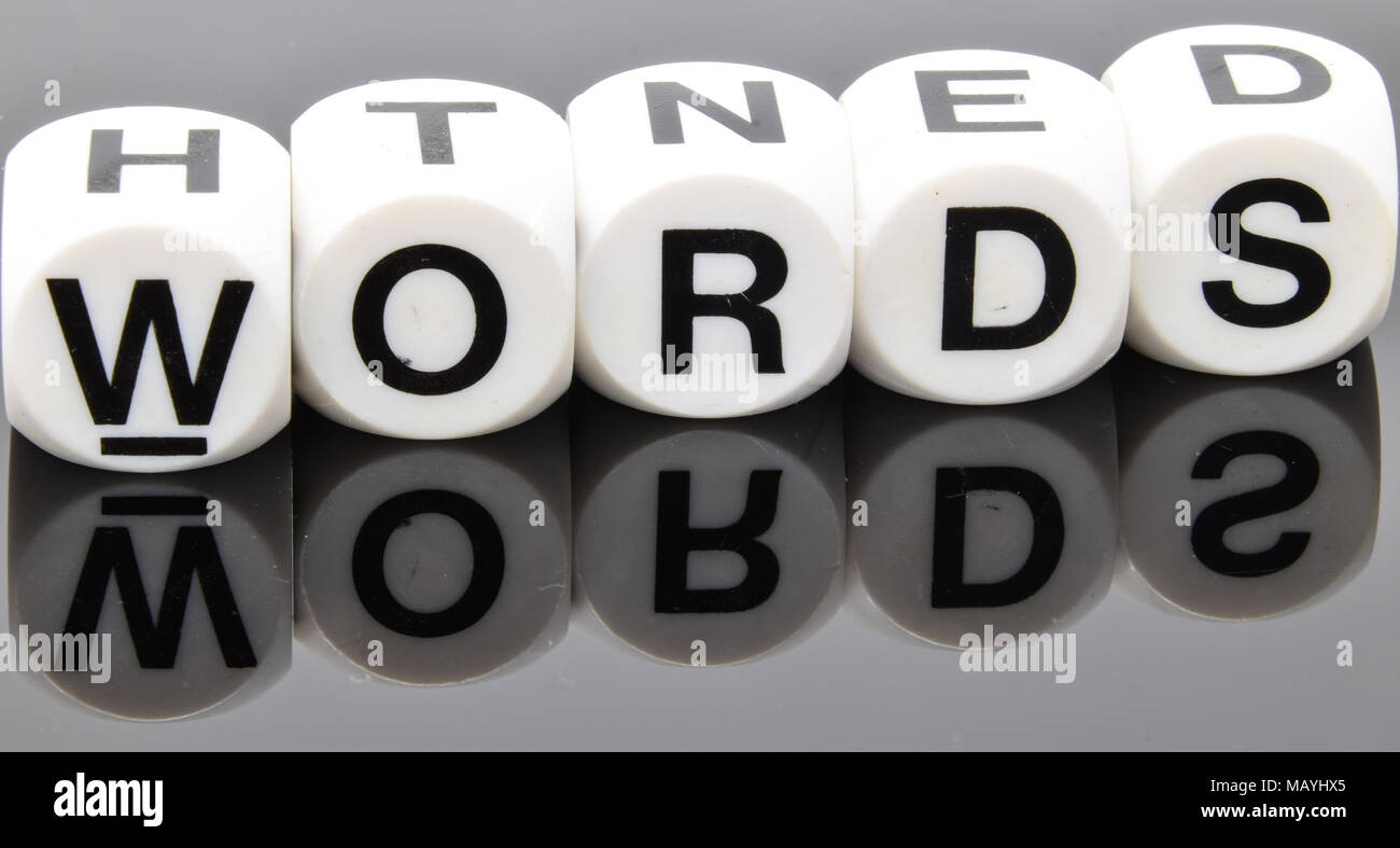 The word WORDS spelt out with letter dice Stock Photo - Alamy
