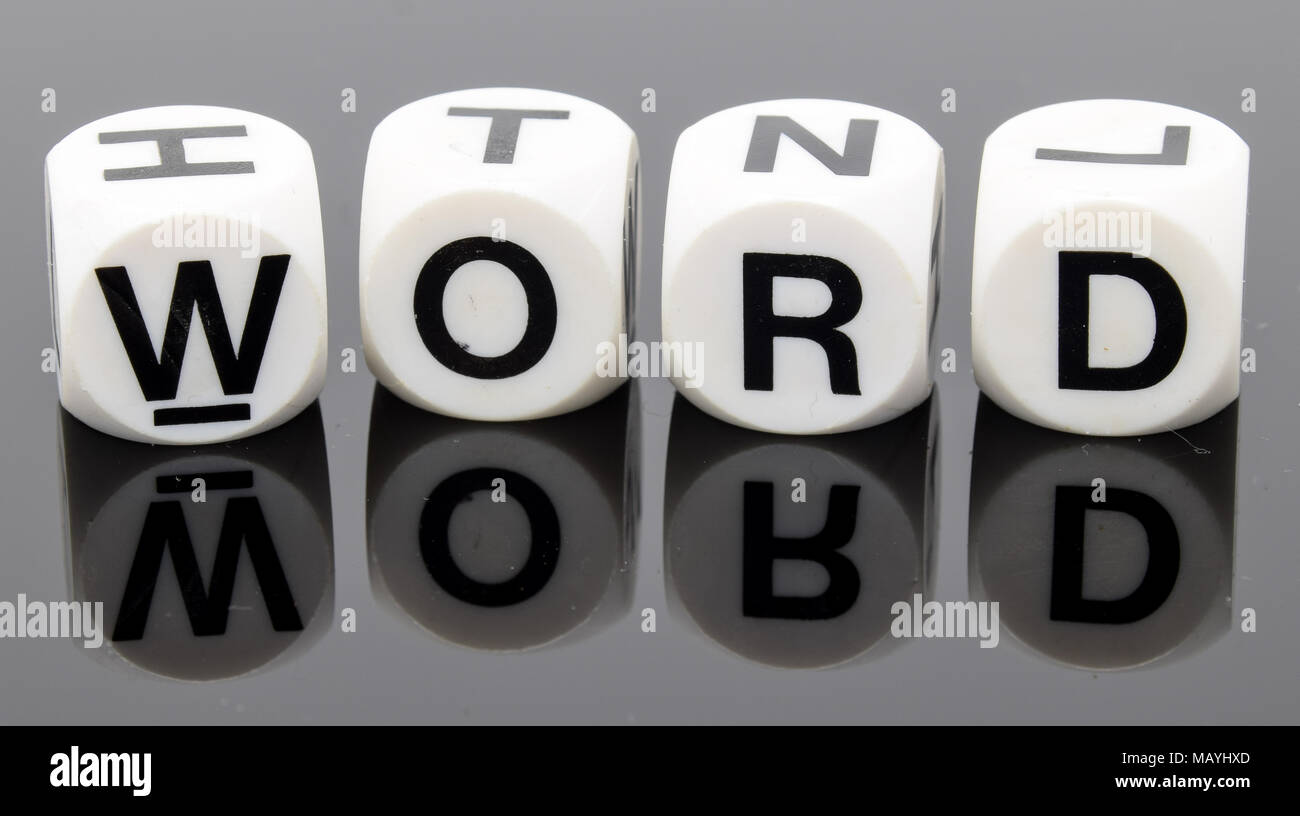 The word Word spelt out in letter dice Stock Photo - Alamy