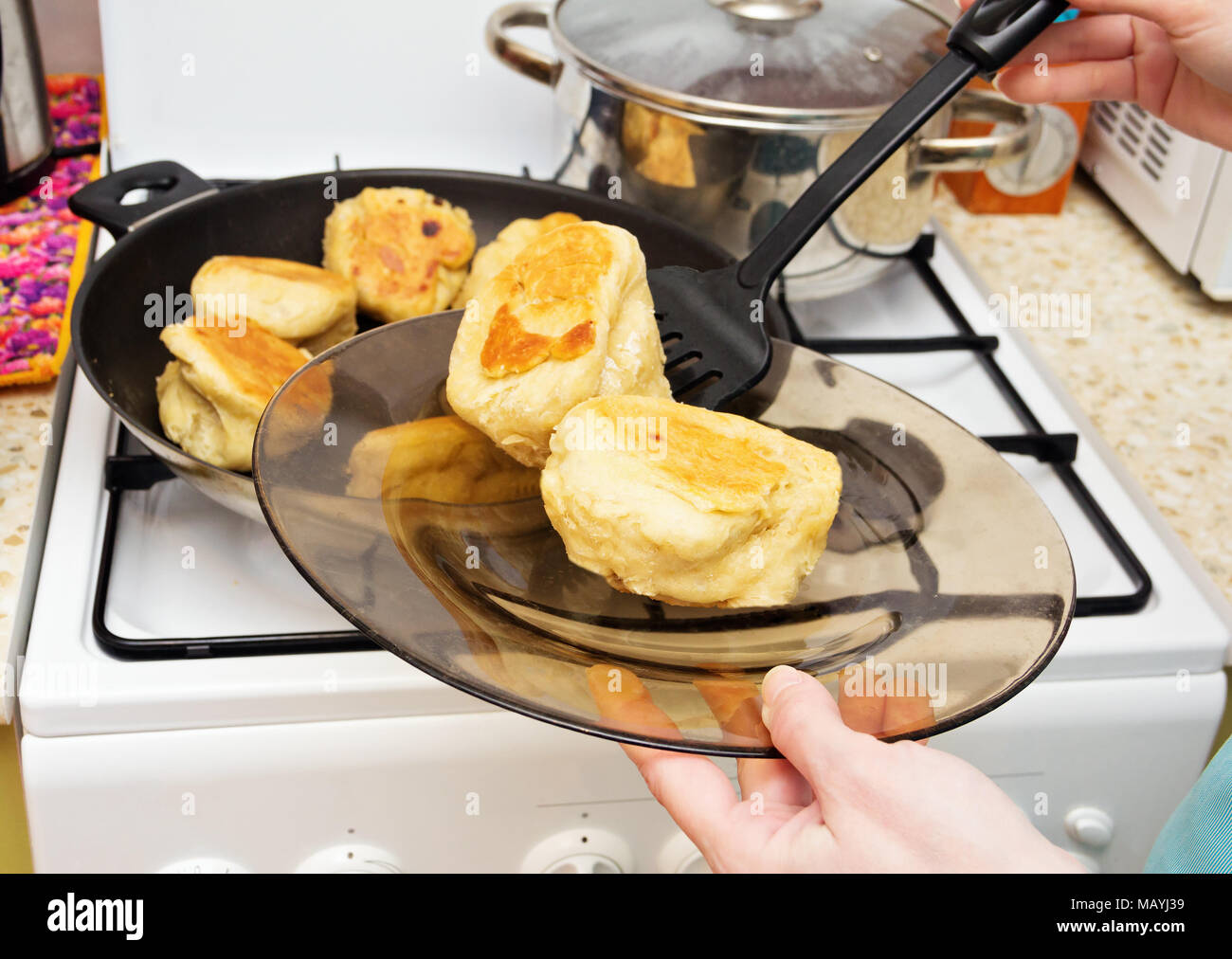 Woman takes pan hi-res stock photography and images - Alamy
