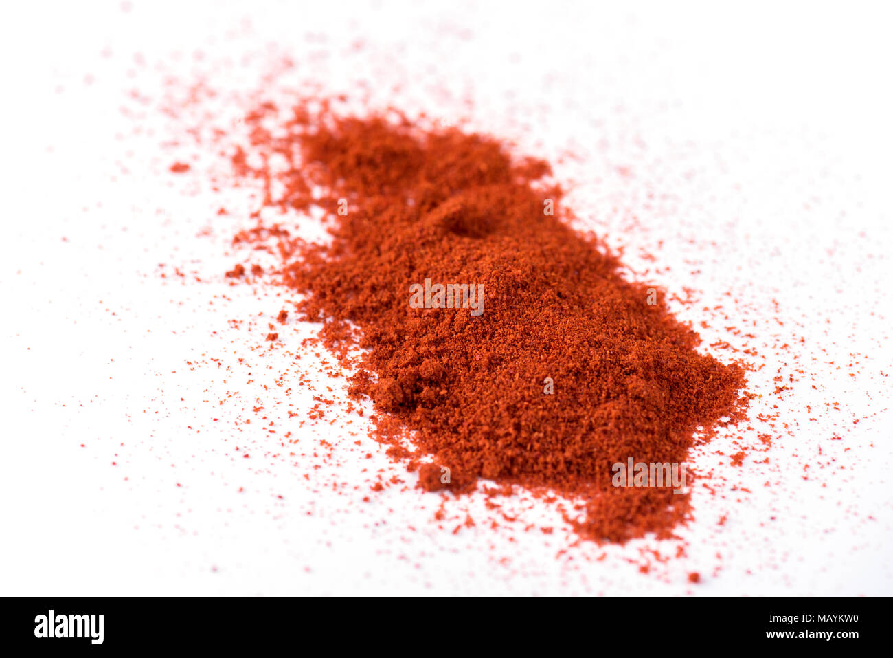 Pile of red paprika powder isolated on white background Stock Photo - Alamy