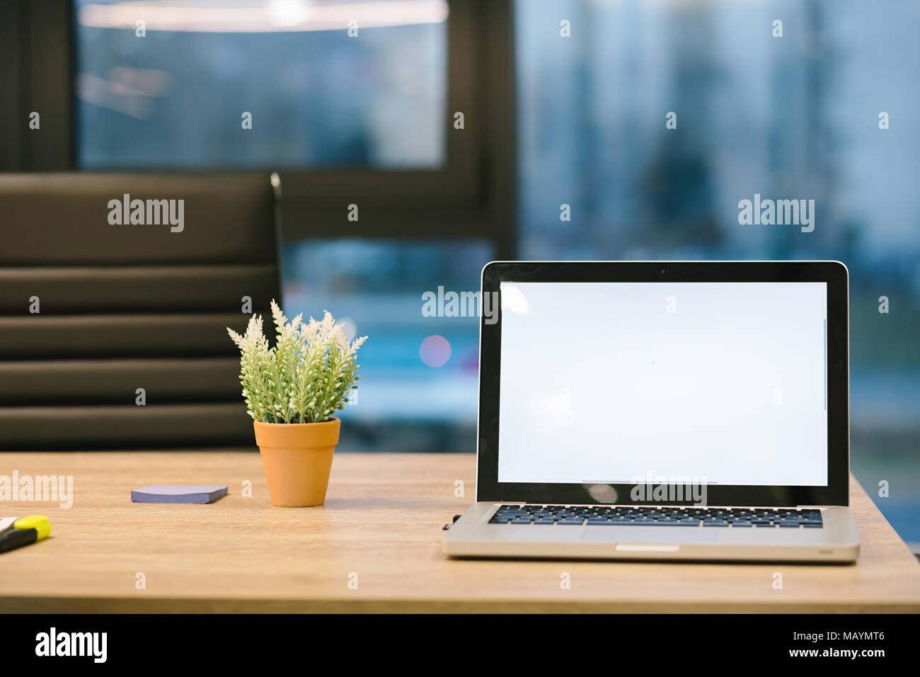 Laptop with blank screen and wireless mouse on desk white Stock Photo ...