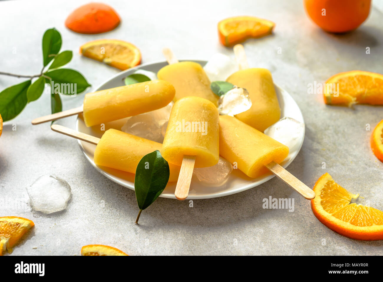 Ice cubes in orange juice hi-res stock photography and images - Alamy